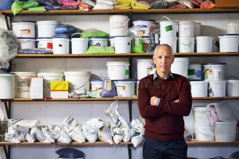 Hes a Proud Store Owner. a Store Owner Standing in Front of His ...