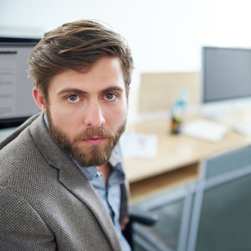 Hes Serious about His Work. a Designer at Work in an Office. Stock ...