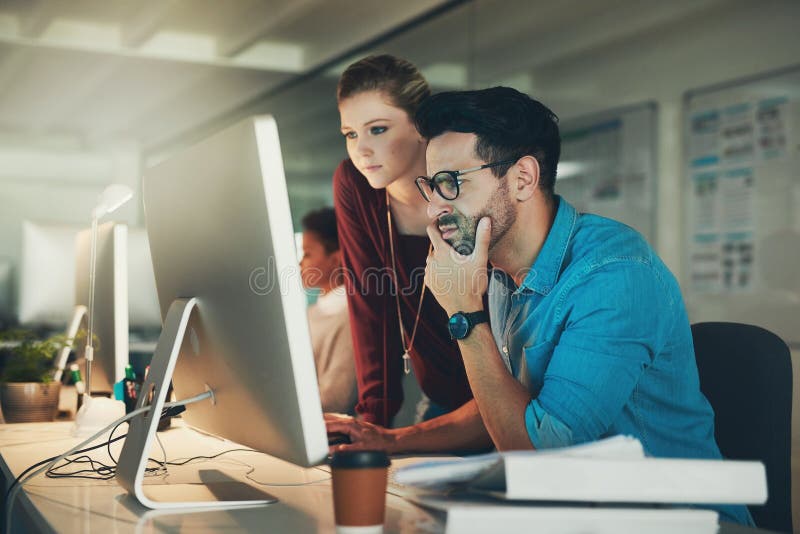 Hes Stumped. Maybe she Can Help. Two Young Businesspeople Looking at a ...