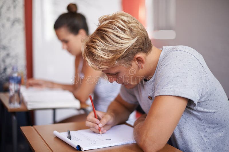 Hes Totally Focused. a Group of University Students Studying Together ...