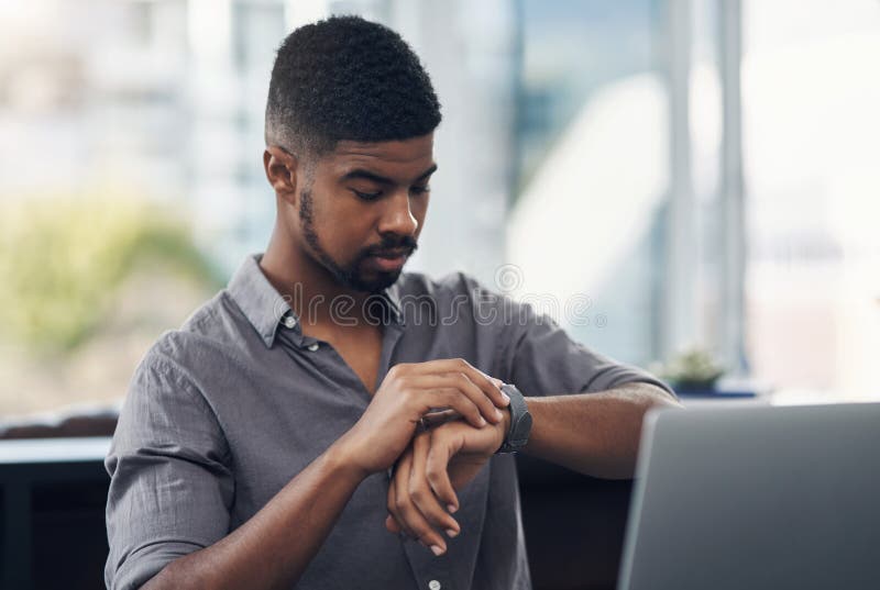 Hes a Very Efficient Employee. a Young Businessman Checking the Time ...