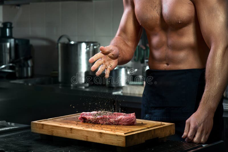 Het sexy chef-kok koken stock foto. Image of keuken, knap - 49064844