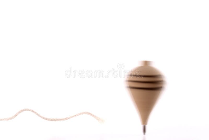 Het werpen van een tol stock foto. Image of speelgoed - 33478568