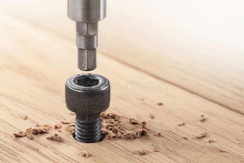 Hex Bolt Hex Bit in Wooden Oaks Plate. Spanner, Bolt, and Nuts Stock ...