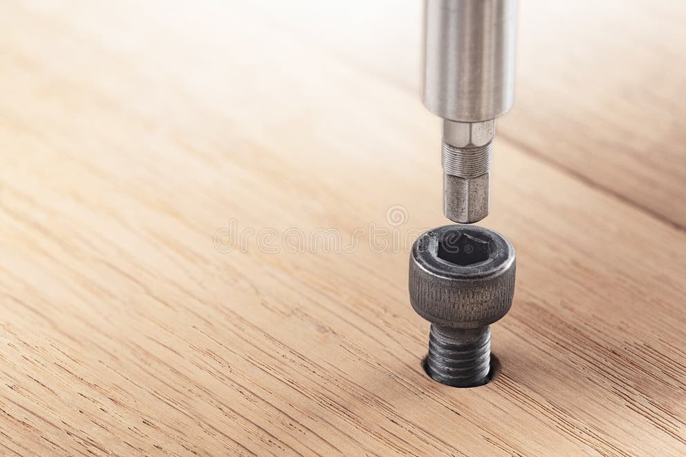 Hex Bolt Hex Bit in Wooden Oaks Plate. Spanner, Bolt, and Nuts Stock ...