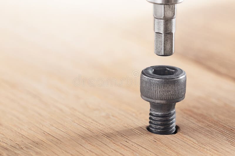 Hex Bolt Hex Bit in Wooden Oaks Plate. Spanner, Bolt, and Nuts Stock ...