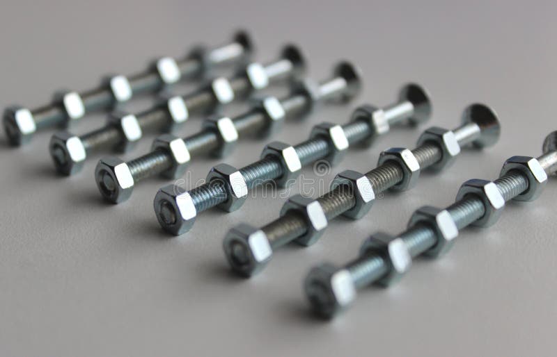 Hex Nuts on a Threaded Hex Bolts Angle View with Soft Focus Stock Photo ...