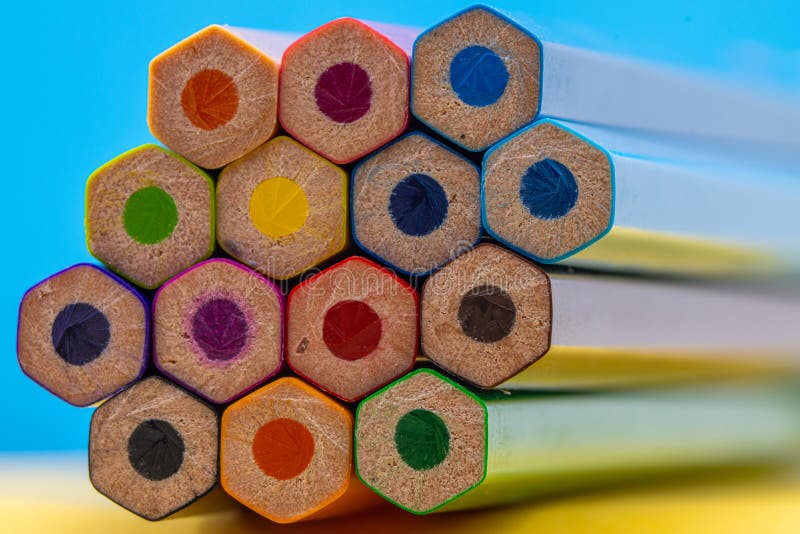 Hexagonal Colored Pencils on Blurred Blue and Yellow Background Stock ...