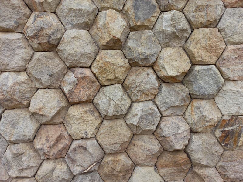 Hexagonal rock wall stock image. Image of pebble, cobblestone - 265094123