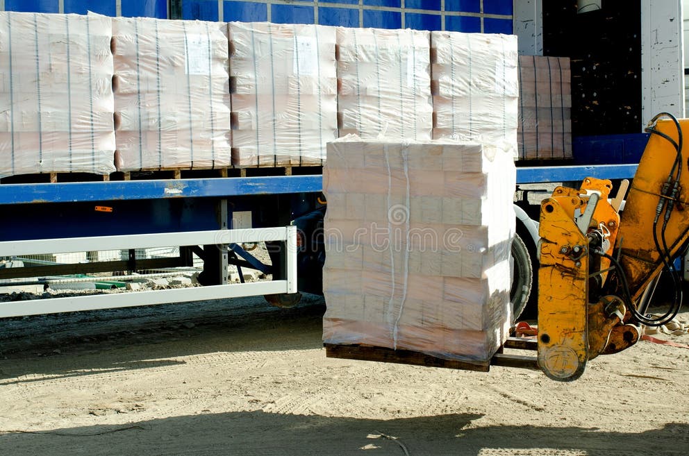 HGV Delivered Concrete Blocks on Construction Site and Telehandler ...