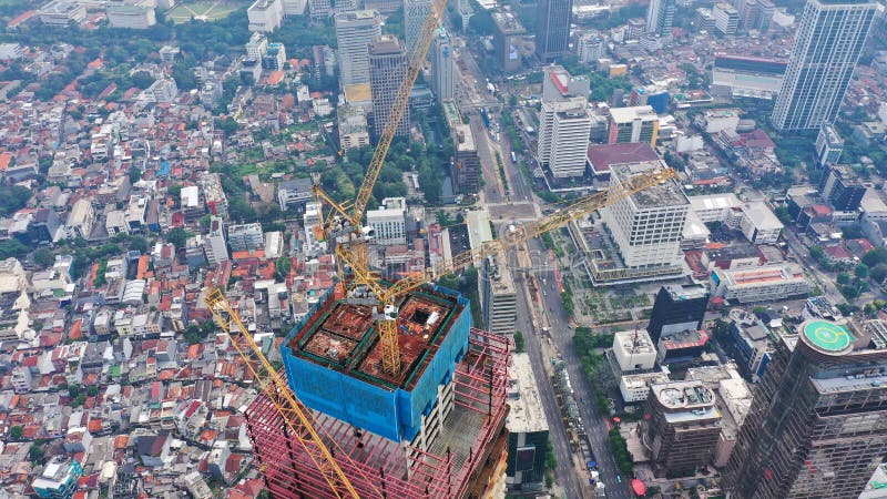 Hi-rise Skeleton Construction Site with the Yellow Crane Stock Image ...