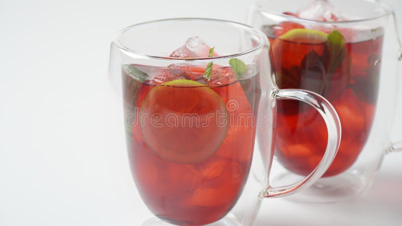 Hibiscus Cold Tea Drink with Ice Cubes and Lemon in Glass Stock Image ...