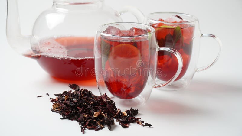 Hibiscus Cold Tea Drink with Ice Cubes and Lemon in Glass Stock Photo ...