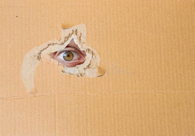 Hidden Eye Watching through Hole in Cardboard Paper Stock Photo - Image ...