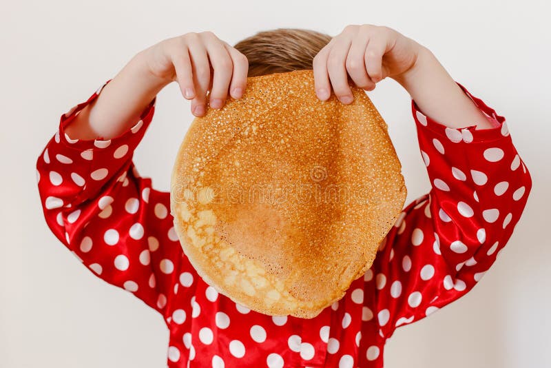 Hiding Behind the Pancakes, the Boy Covered His Face with a Large ...
