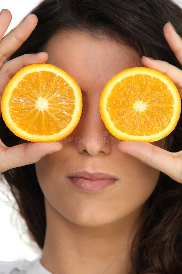 Hiding Her Eyes with Oranges Stock Image - Image of hiding, grin: 22630369