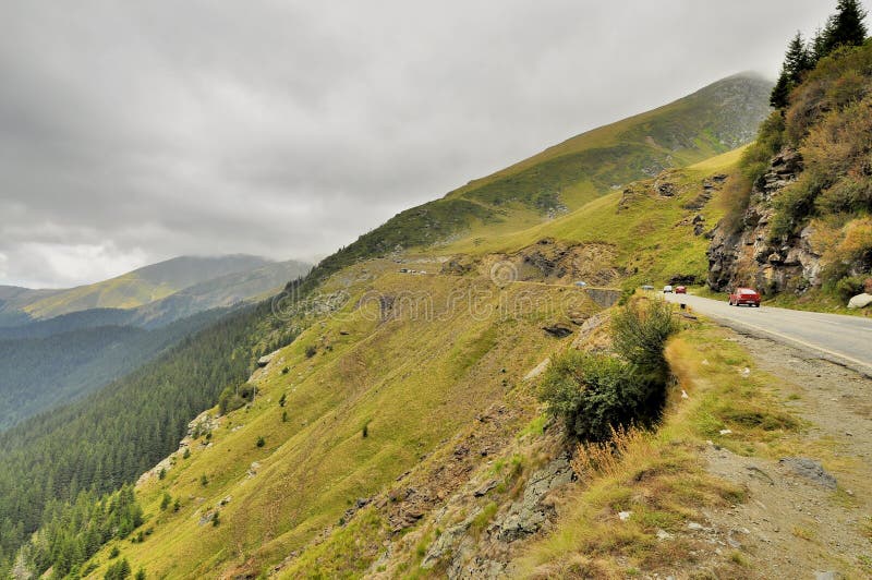 High Alpine Road with Moving Cars Stock Image - Image of countryside ...