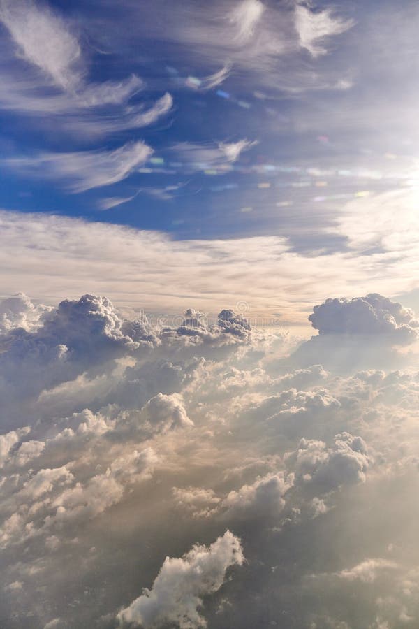 High Altitude Clouds Moving Across the Sky with the Sun Backlit Stock ...