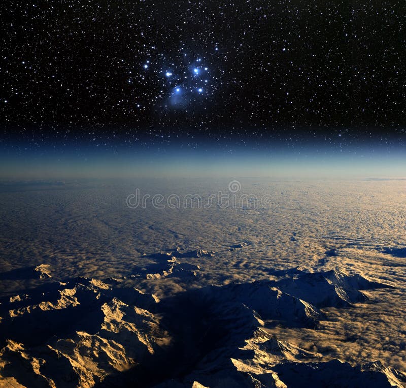 High Altitude View of the Night Sky Above a Cloudy Mountain Range ...