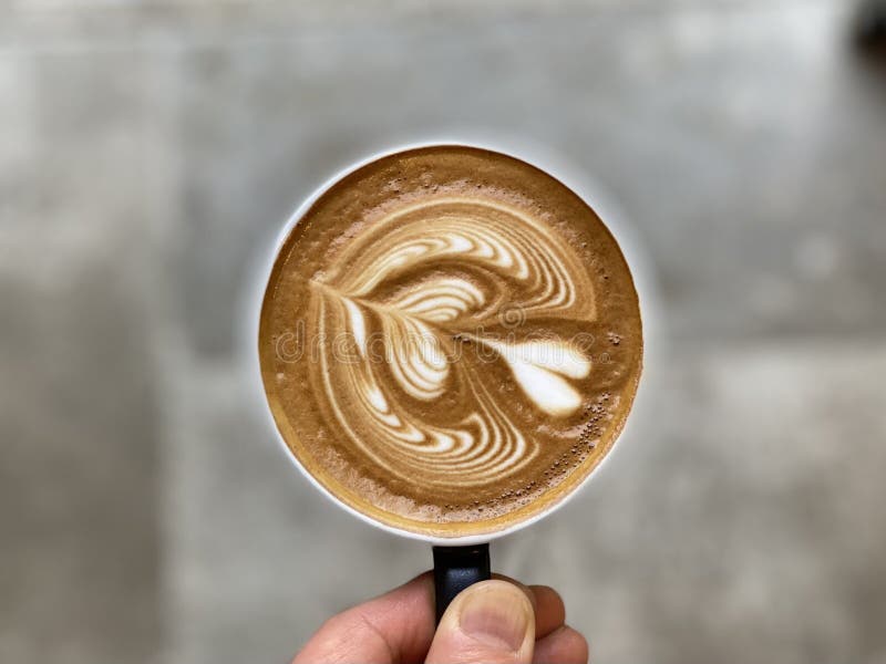 High Angel View of Coffee Cup on Hand Stock Photo - Image of angel ...