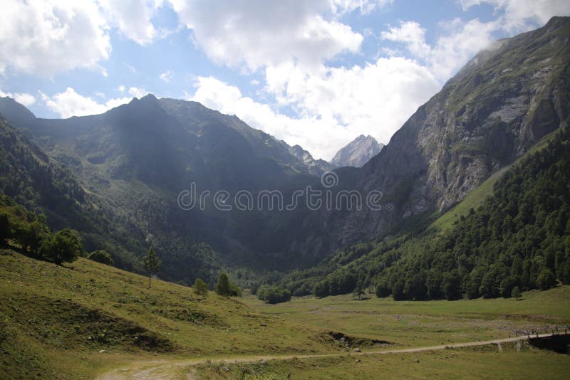 High-angle of Aran Valley, Forested, Misty, Sunlit Pyrenees Mountain ...