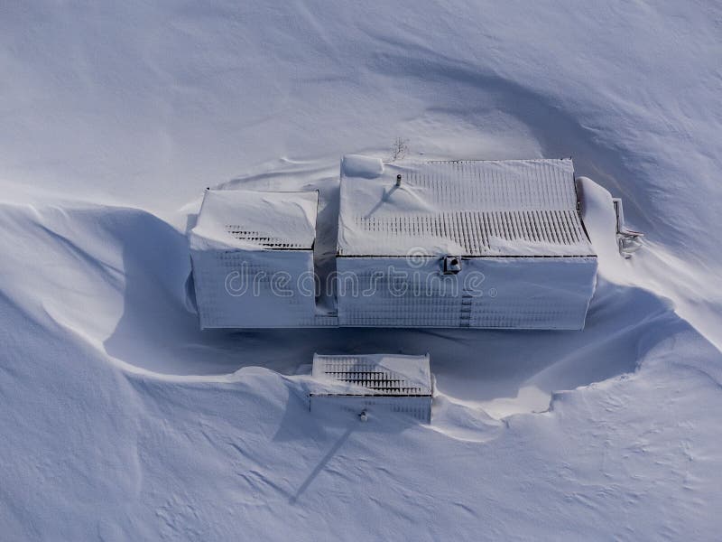 High-angle of Building Covered with Snow and Sunlight in Stock Image ...