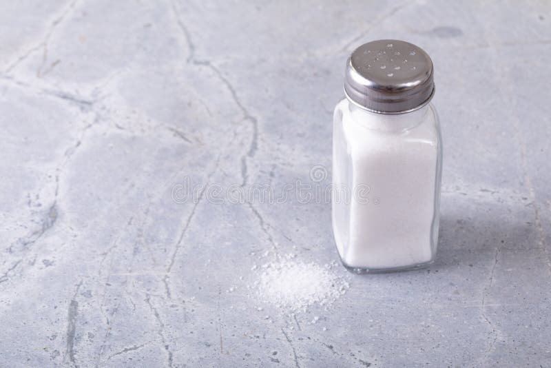 High Angle Close-up of Salt Shaker at Table Stock Image - Image of ...