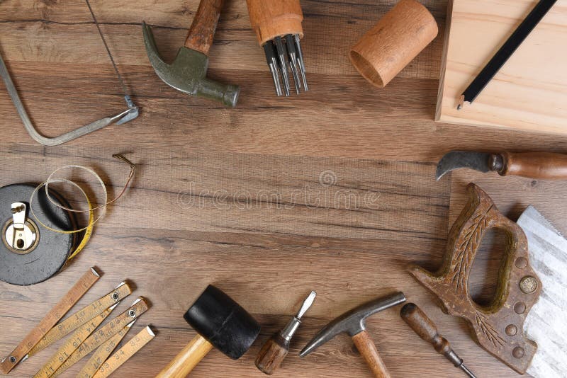 High Angle Closeup of a Large Group of Tools Arranged on a Wood ...