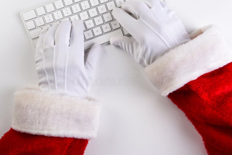 High Angle Closeup of Santa Claus Hands Using His Computer Keyboard ...