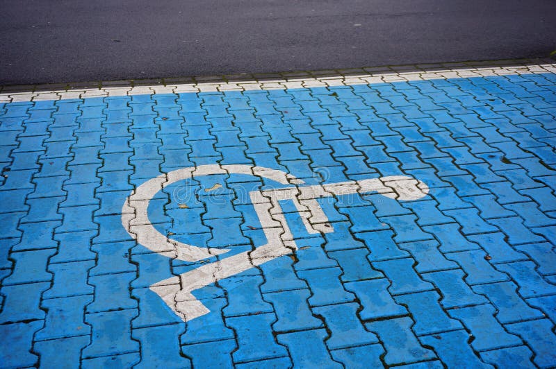 Blue Handicap Sign on the Street - a Symbol for Mobility Aid for People ...