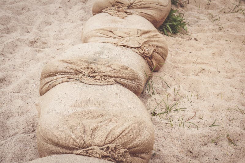 High Angle Closeup Shot of a Row of Full Bags on a Sand Stock Image ...
