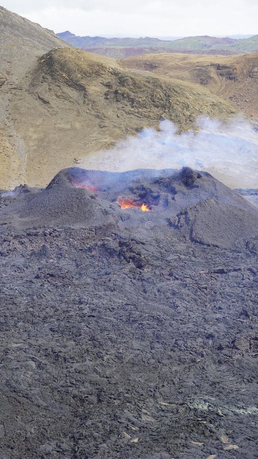 High-angle Closeup of a Volcanic Eruption Round Crater Smog Fire in ...