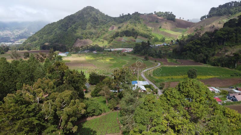 High-angle of a Dramatic Mountain Countryside of Fields and Farms in ...