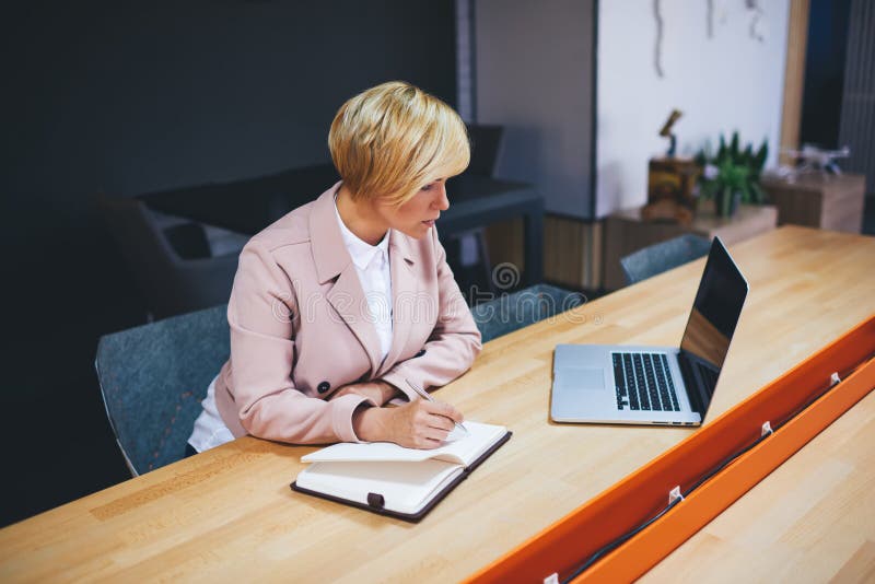 Serious Manager Working on Laptop in Conference Room Stock Photo ...
