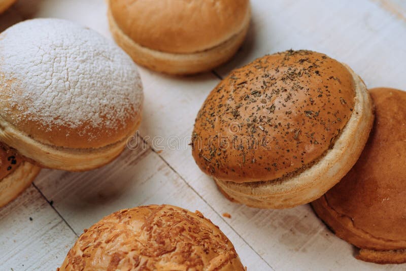 High Angle of the Freshly Baked Bun Breads Put on the White Table ...