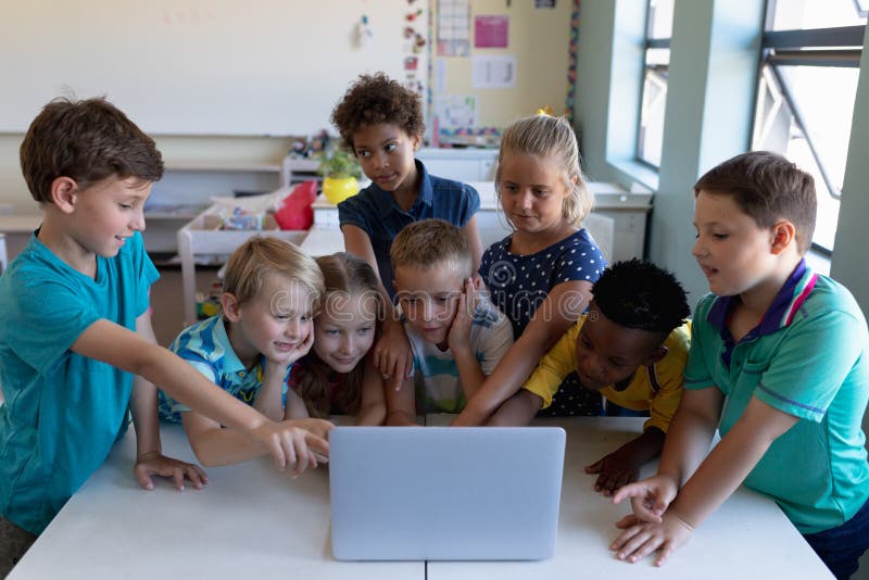Group of Schoolchildren Using a Laptop Computer in an Elementary School ...