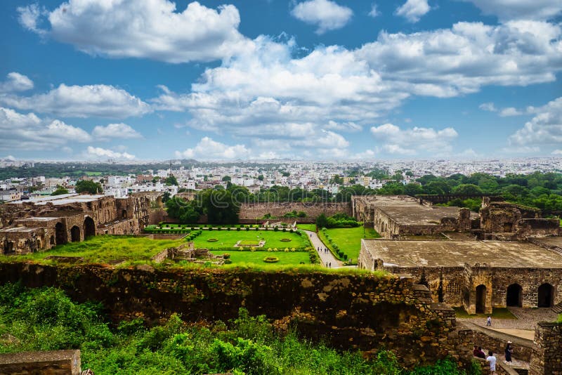 High-angle of Golconda Fort Ruins with Grass Around and Cloudy Sky ...