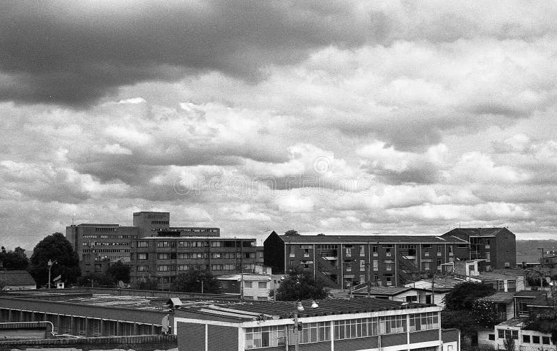 High Angle Grey Scale Shot of the Buildings Underneath the Cloudy Sky ...