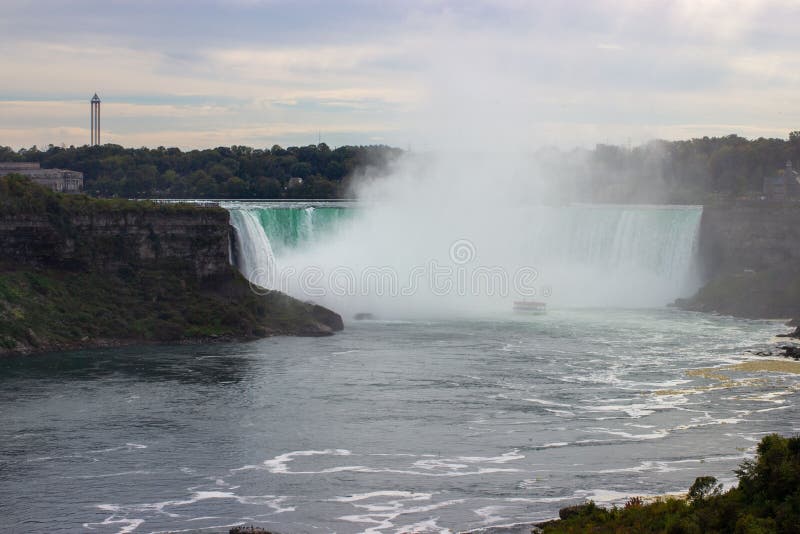 High-angle of Horseshoe Falls Flowing Down and Making Mist Stock Photo ...