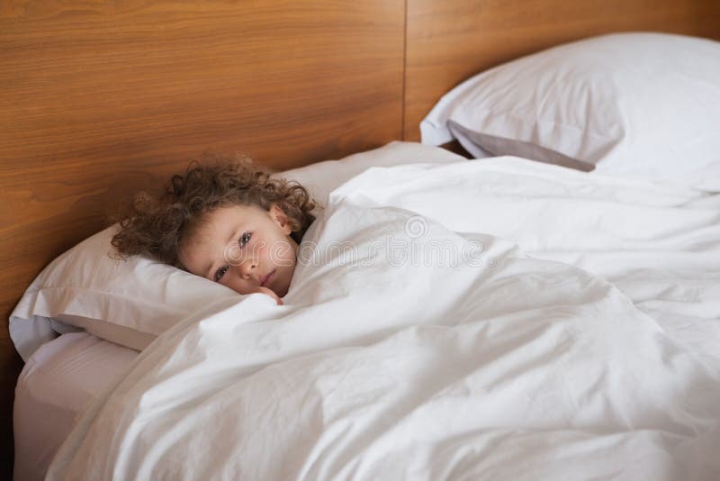 High Angle Portrait of a Girl Resting in Bed Stock Photo - Image of ...