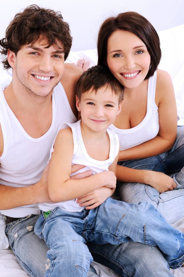 Happy Family with Two Children Sitting on White Floor Stock Image ...