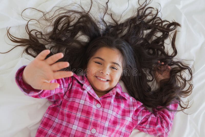 High Angle Portrait of Smiling Girl Lying in Bed Stock Image - Image of ...