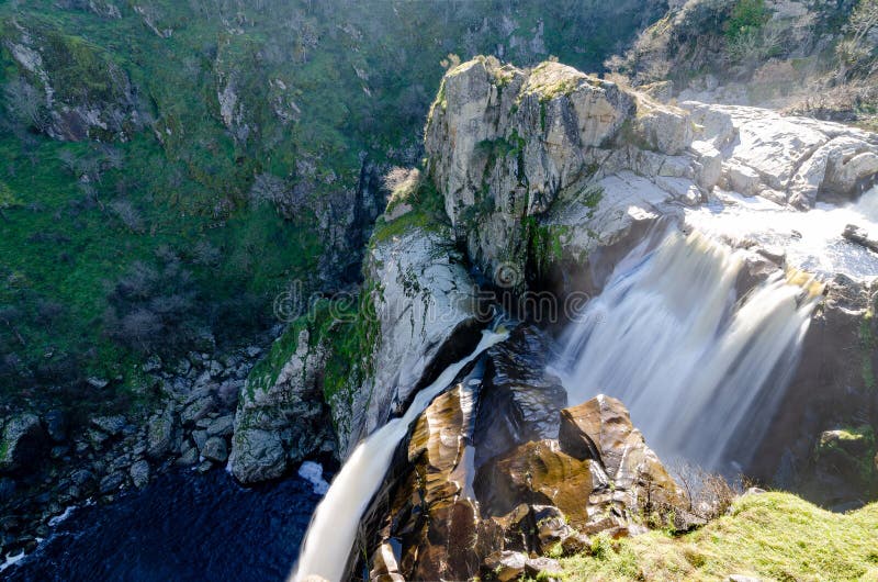 High Angle Shot of a Beautiful Waterfalls with Strong Cascading Water ...