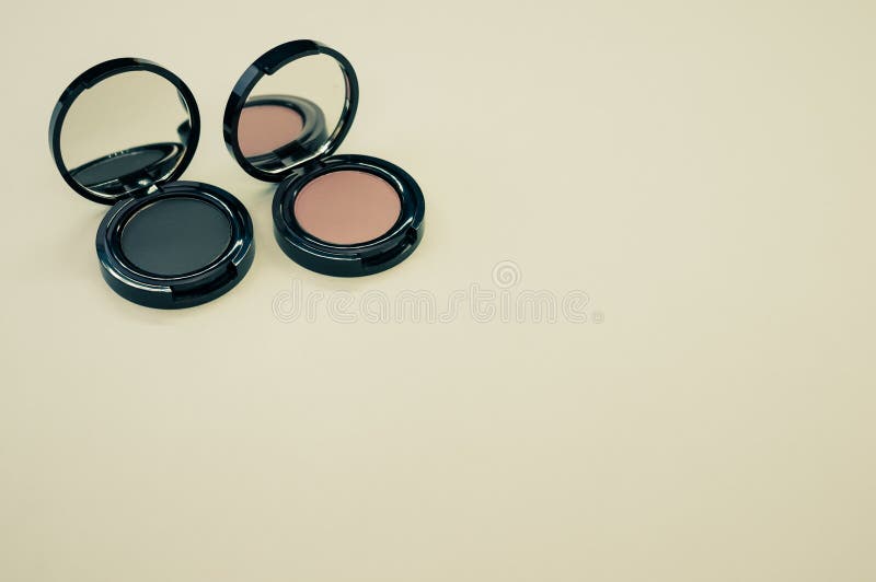 High Angle Shot of Black and Light Pink Single Eyeshadow Palettes with ...