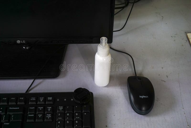 High Angle Shot of the Bottle of Sanitizer by a Computer, a Keyboard ...