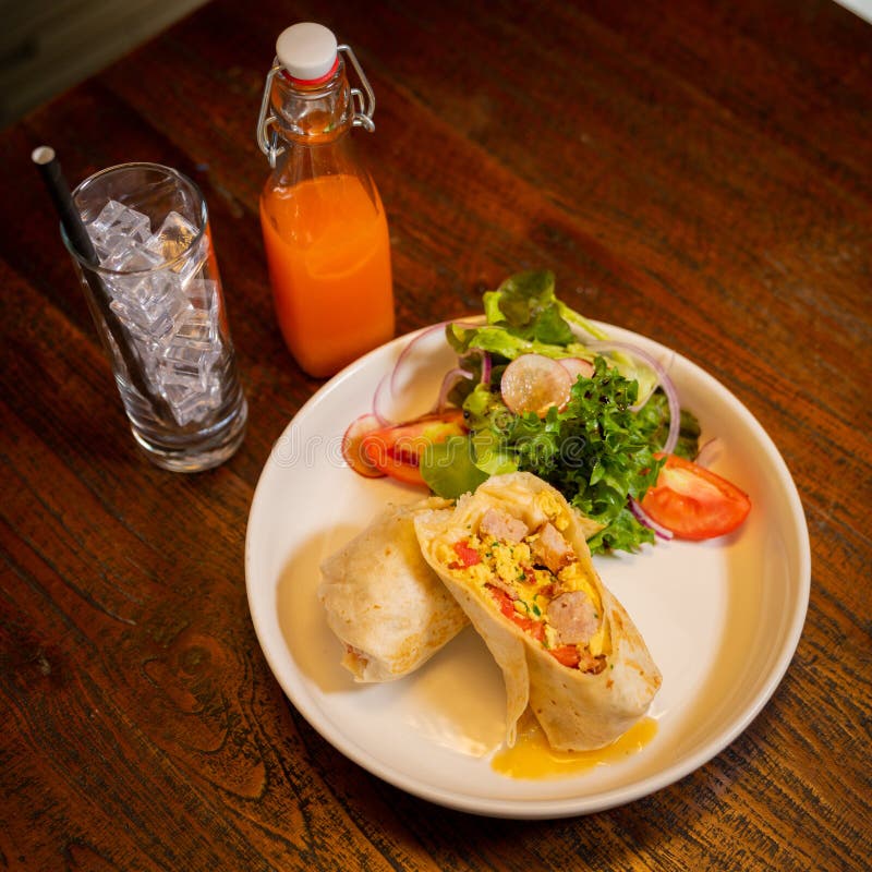 Breakfast Spread on a Plate with a Tortillas and a Side Salad Stock ...