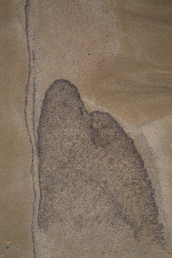 High Angle Shot of a Brown Sand Wth Black Lined Parts. Stock Image ...