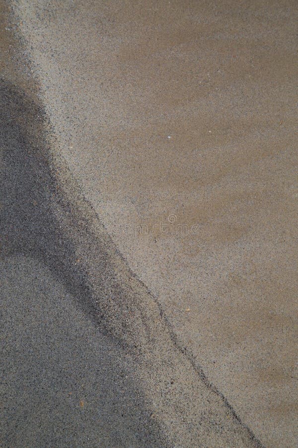 High Angle Shot of a Brown Sand Wth Black Lined Parts. Stock Photo ...