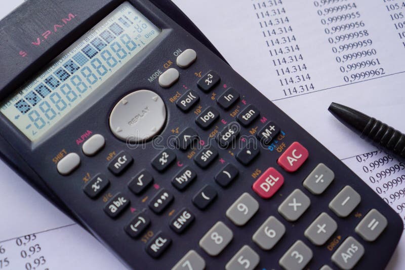 High Angle Shot of a Calculator and a Pen on a Numbers Sheet Stock ...