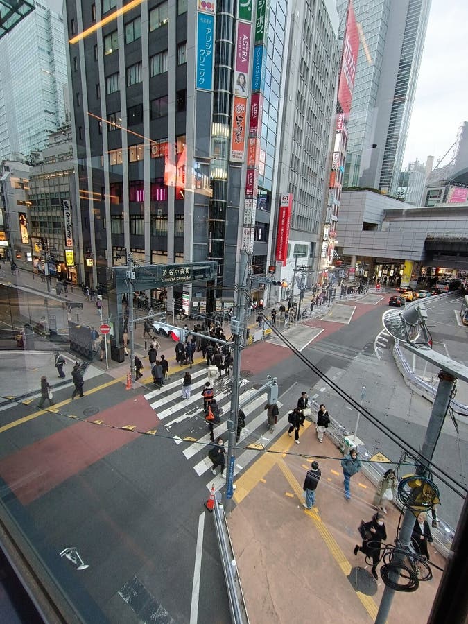 A High-angle Shot Capturing the Movement of People and Vehicles at a ...